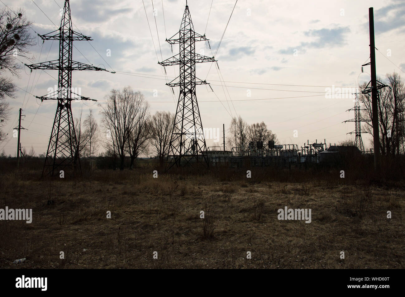 High-voltage power transmission line with substation and towers with ...