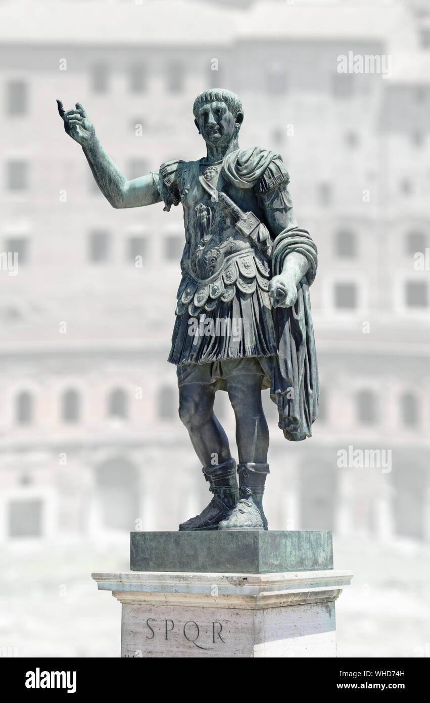 Statue of Emperor Trajan from Trajan's Forum in Rome. With a building ...