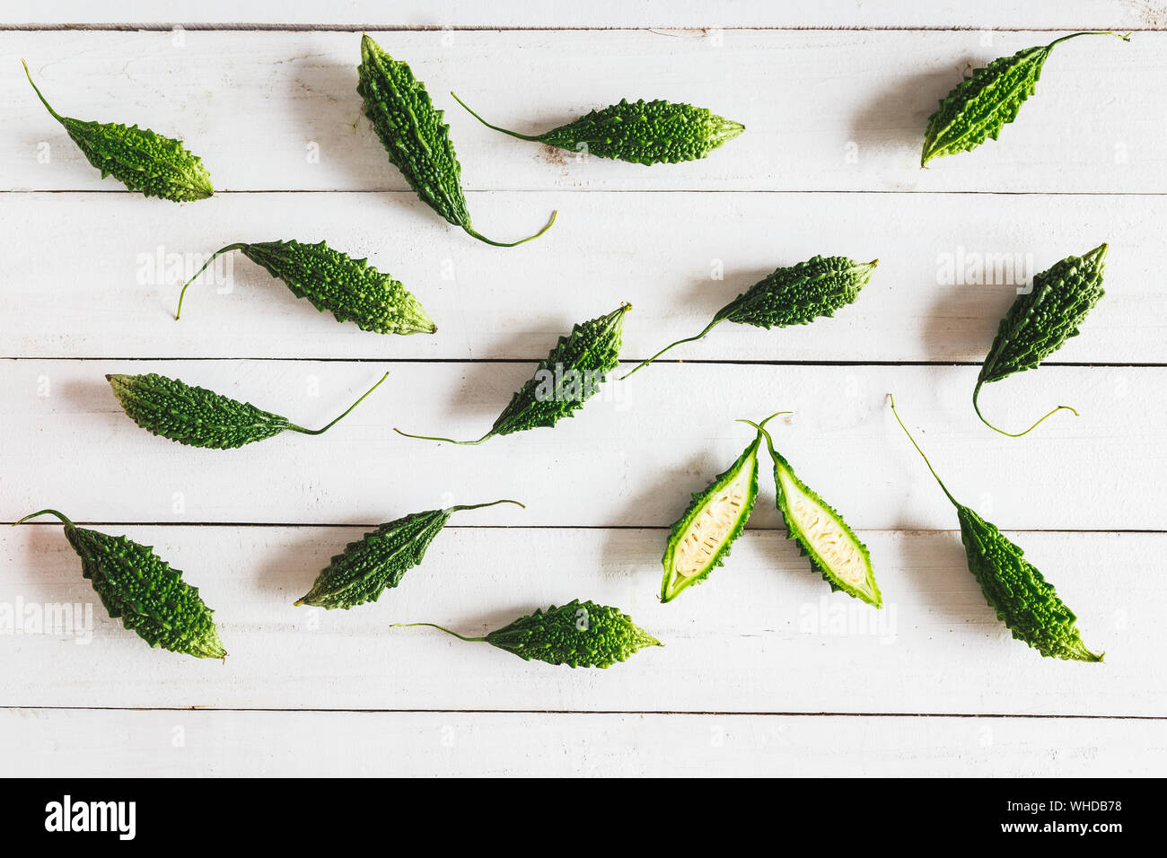 Backgrounds Of Bitter Gourd On White Wooden Plank Stock Photo - Alamy