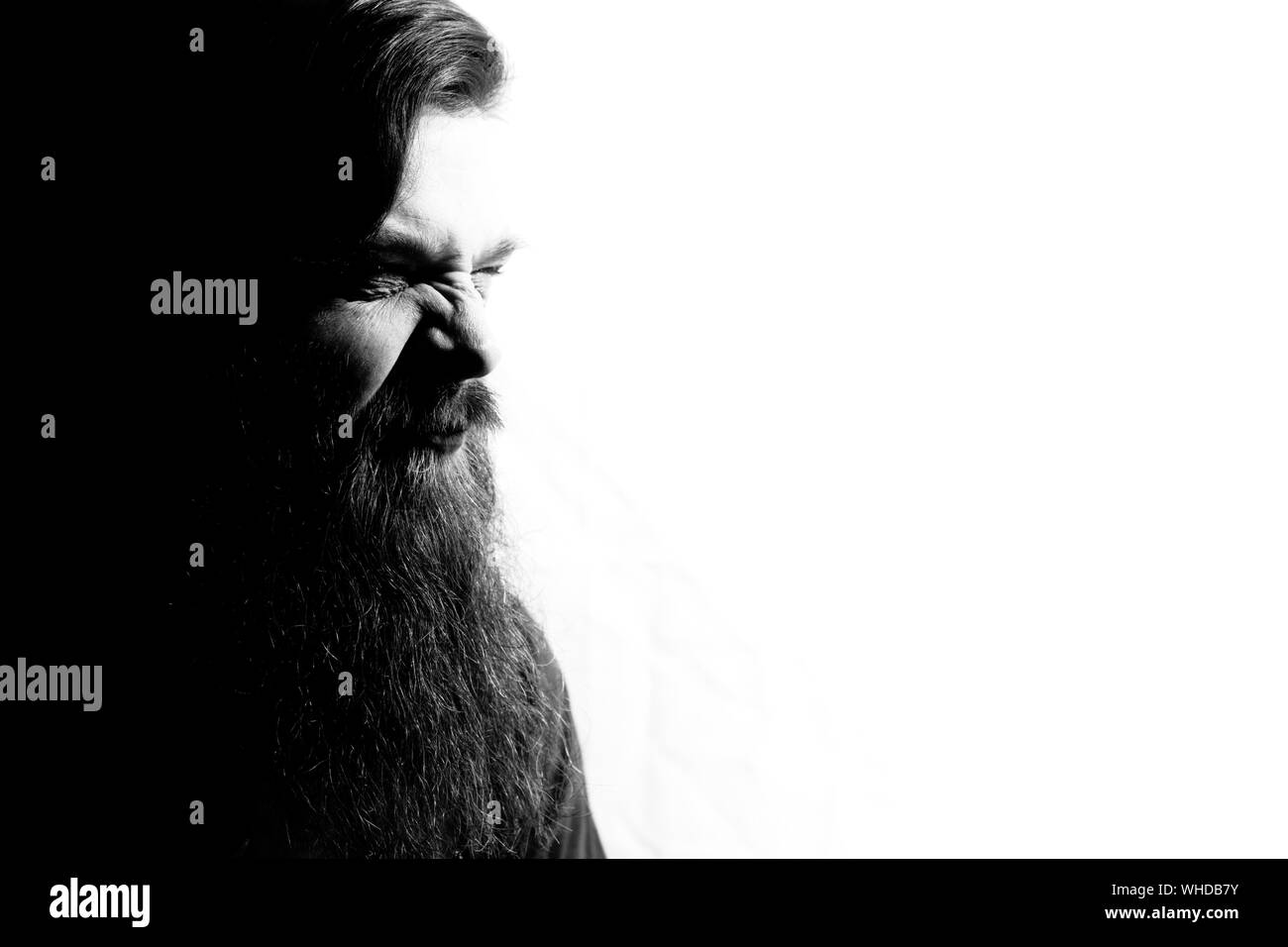 Bearded Man Making Face Against White Background Stock Photo - Alamy