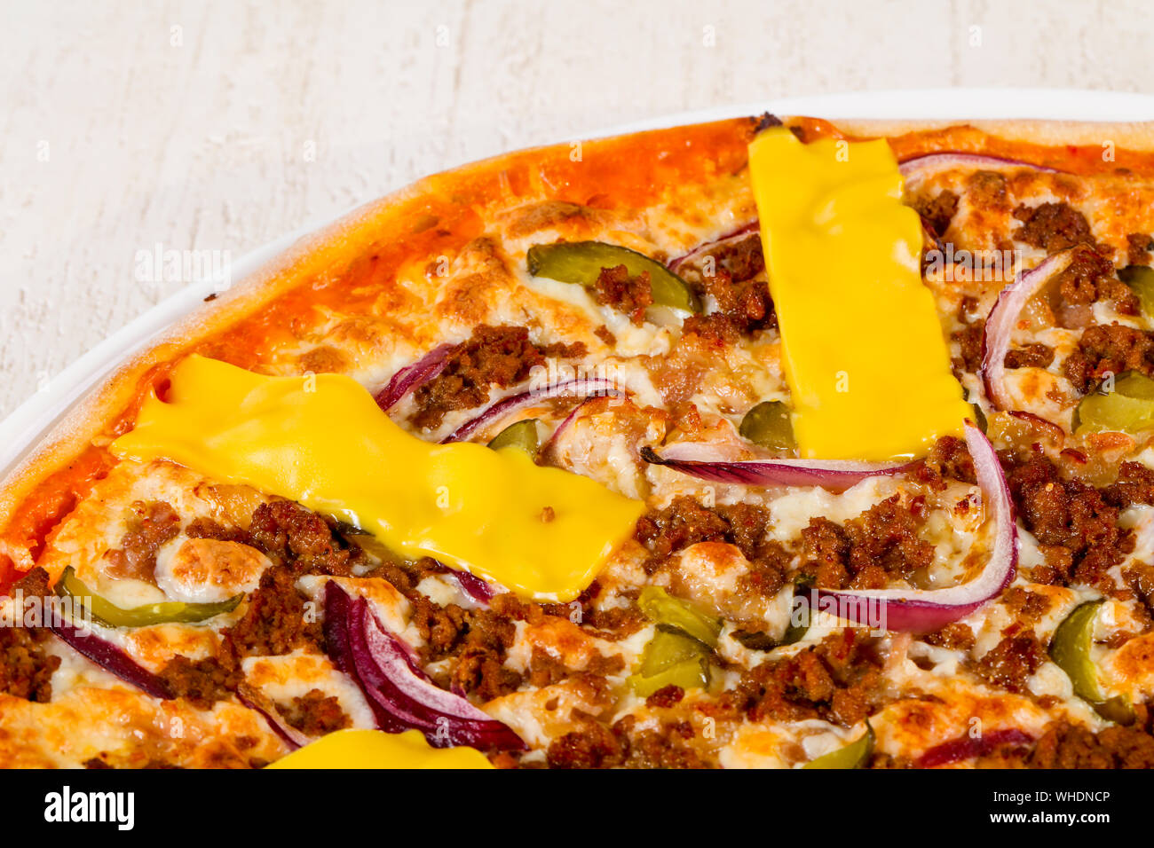 Pizza with minced meat and cheese Stock Photo - Alamy