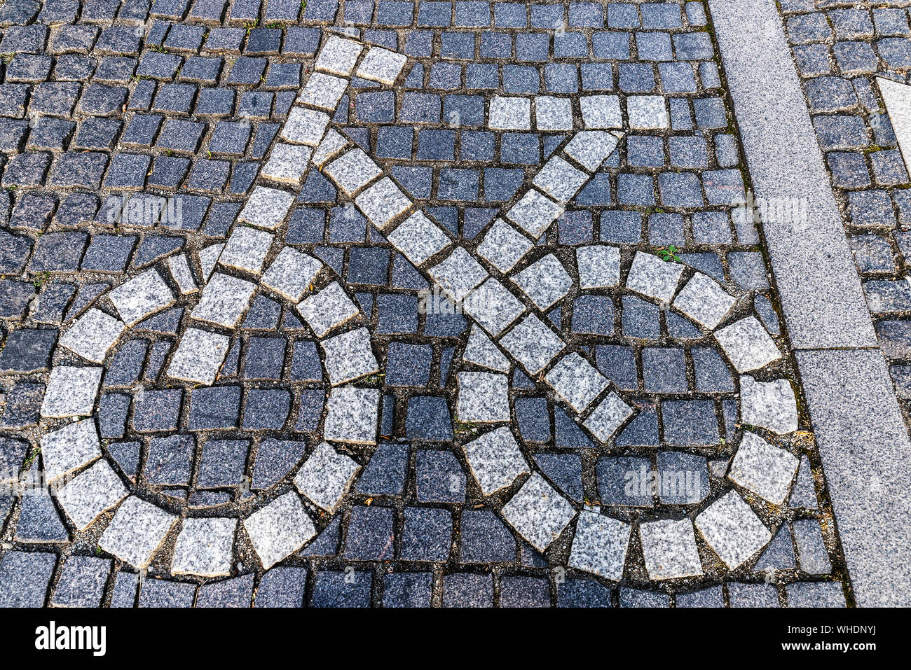Bicycle road sign made of stone pavers on bike lane in Copenhagen ...