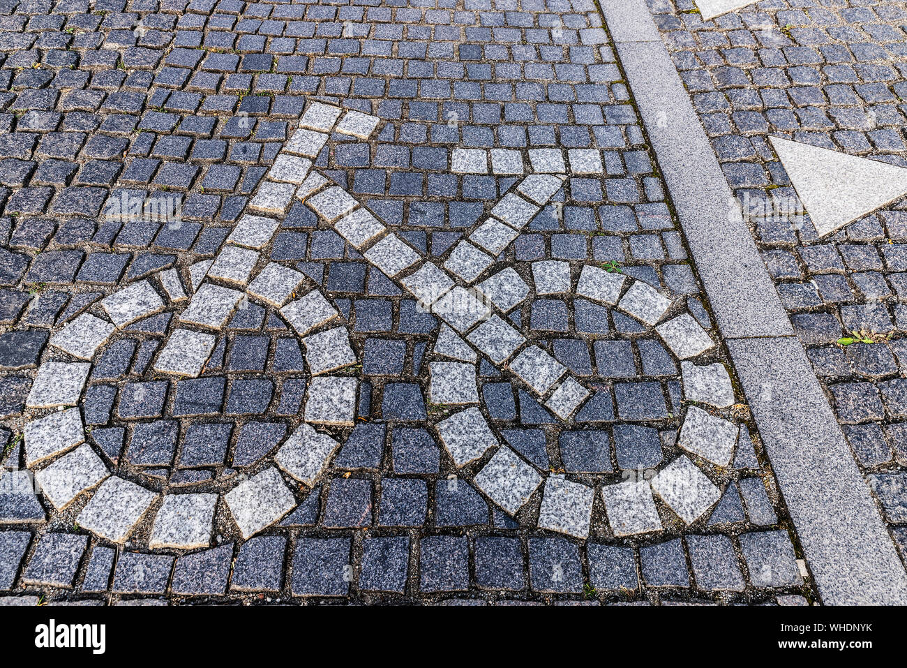 Bicycle road sign made of stone pavers on bike lane in Copenhagen ...