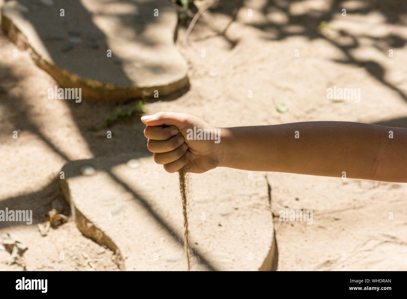 Hand pouring sand hi-res stock photography and images - Alamy