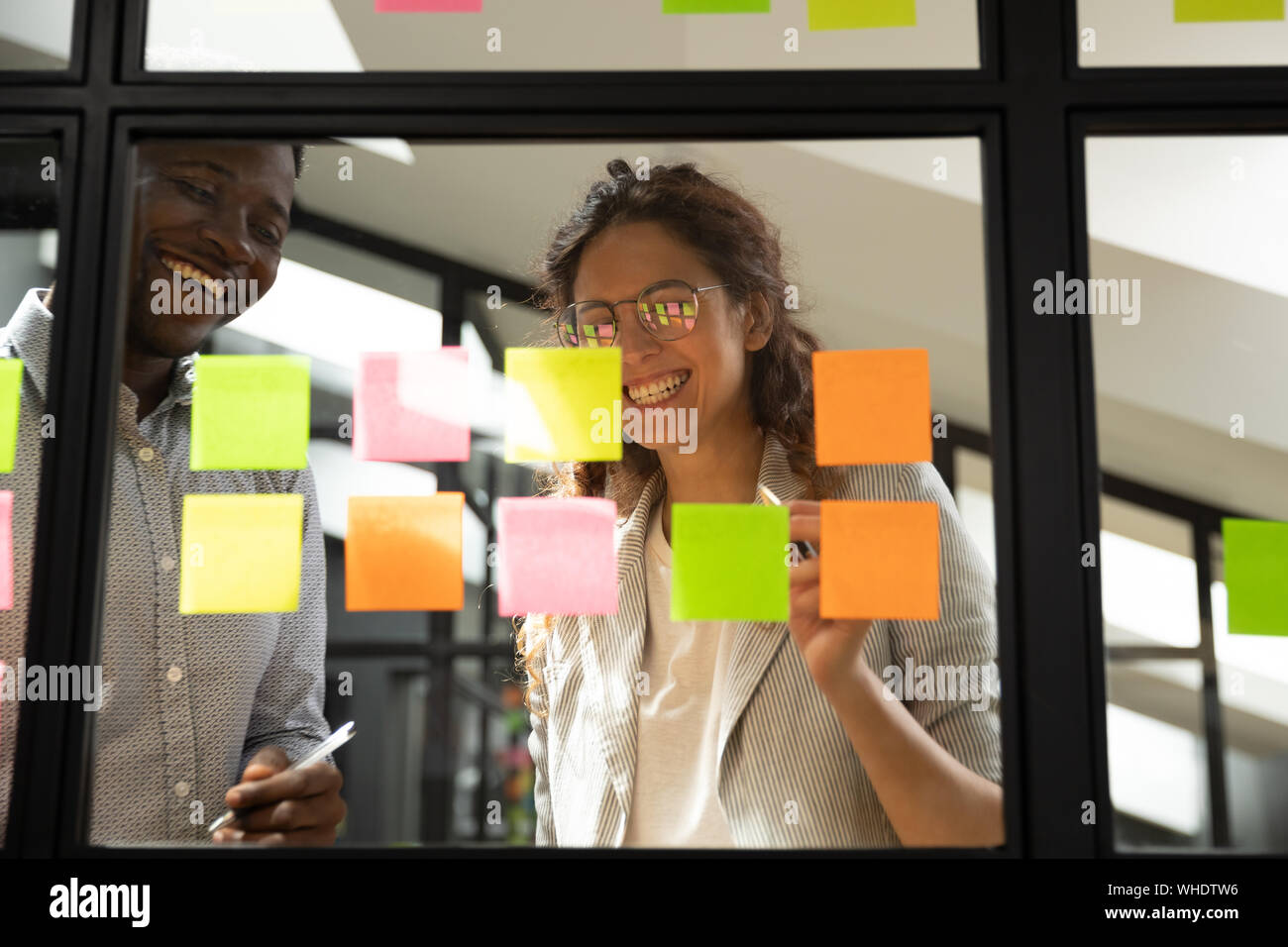 Two diverse office workers working hi-res stock photography and images ...