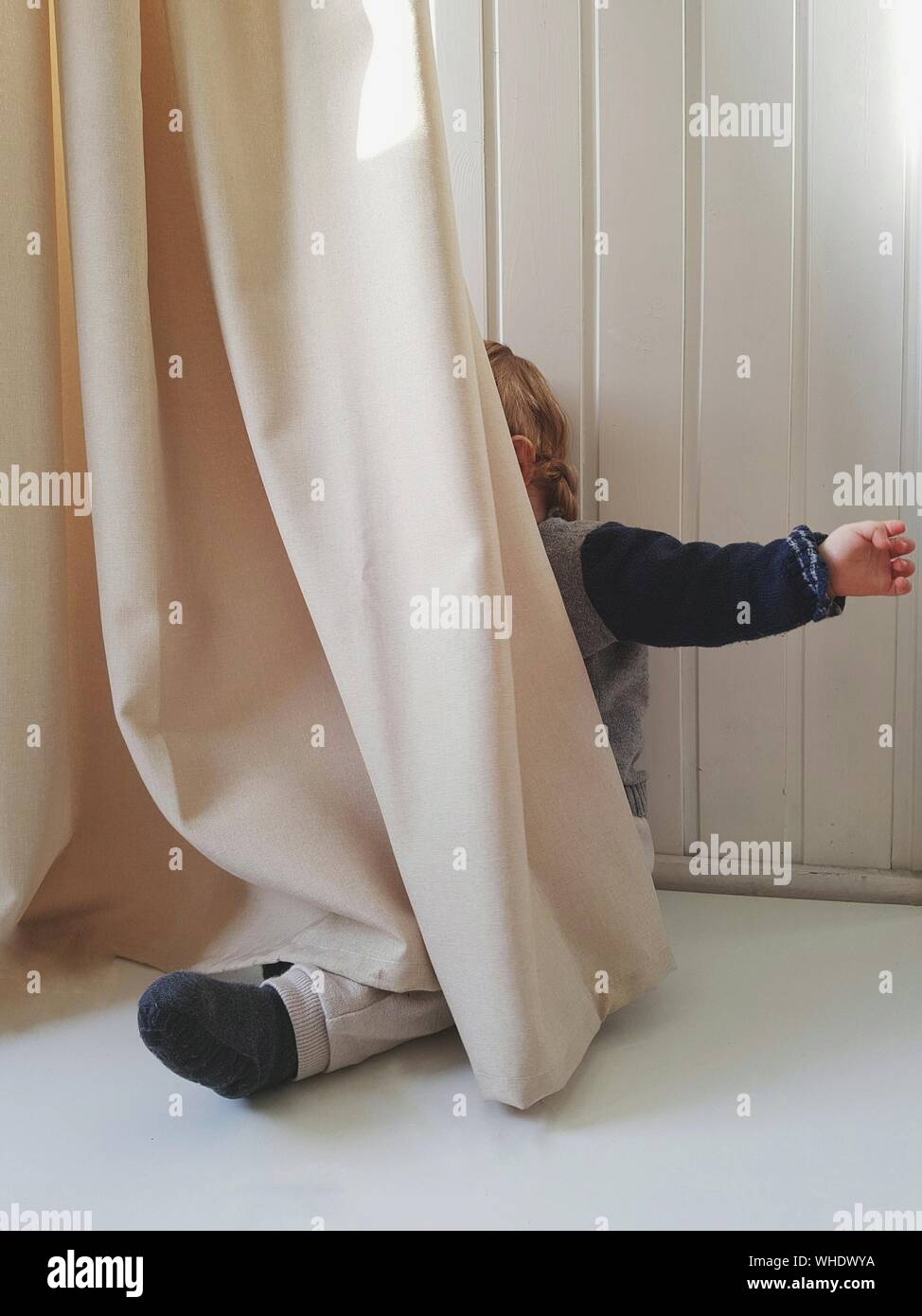 Hand behind fabric hi-res stock photography and images - Alamy