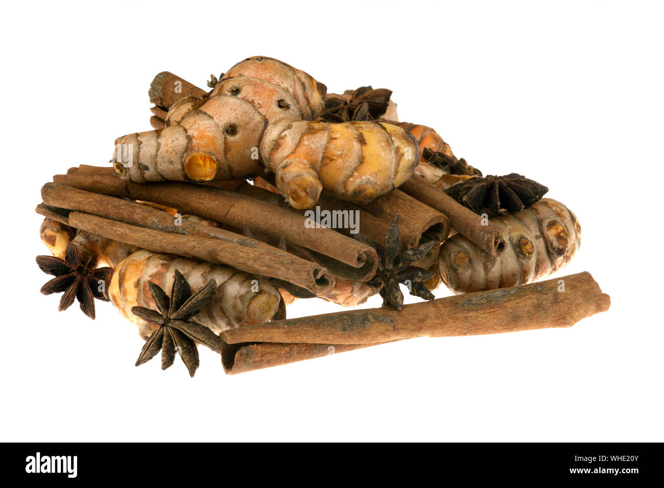 Fresh turmeric cinnamon and star anise isolated on a white background ...