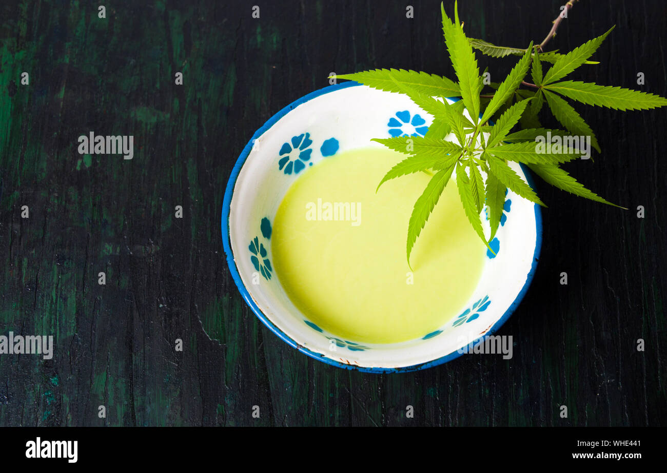 Butter with cannabis plant in a bowl top view Stock Photo - Alamy