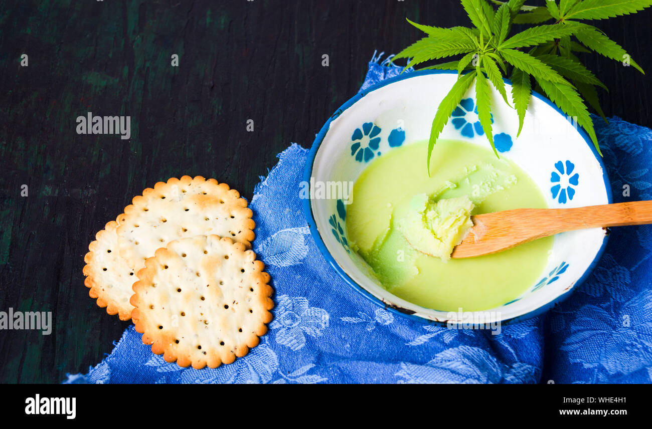Butter with cannabis plant in a bowl top view Stock Photo - Alamy