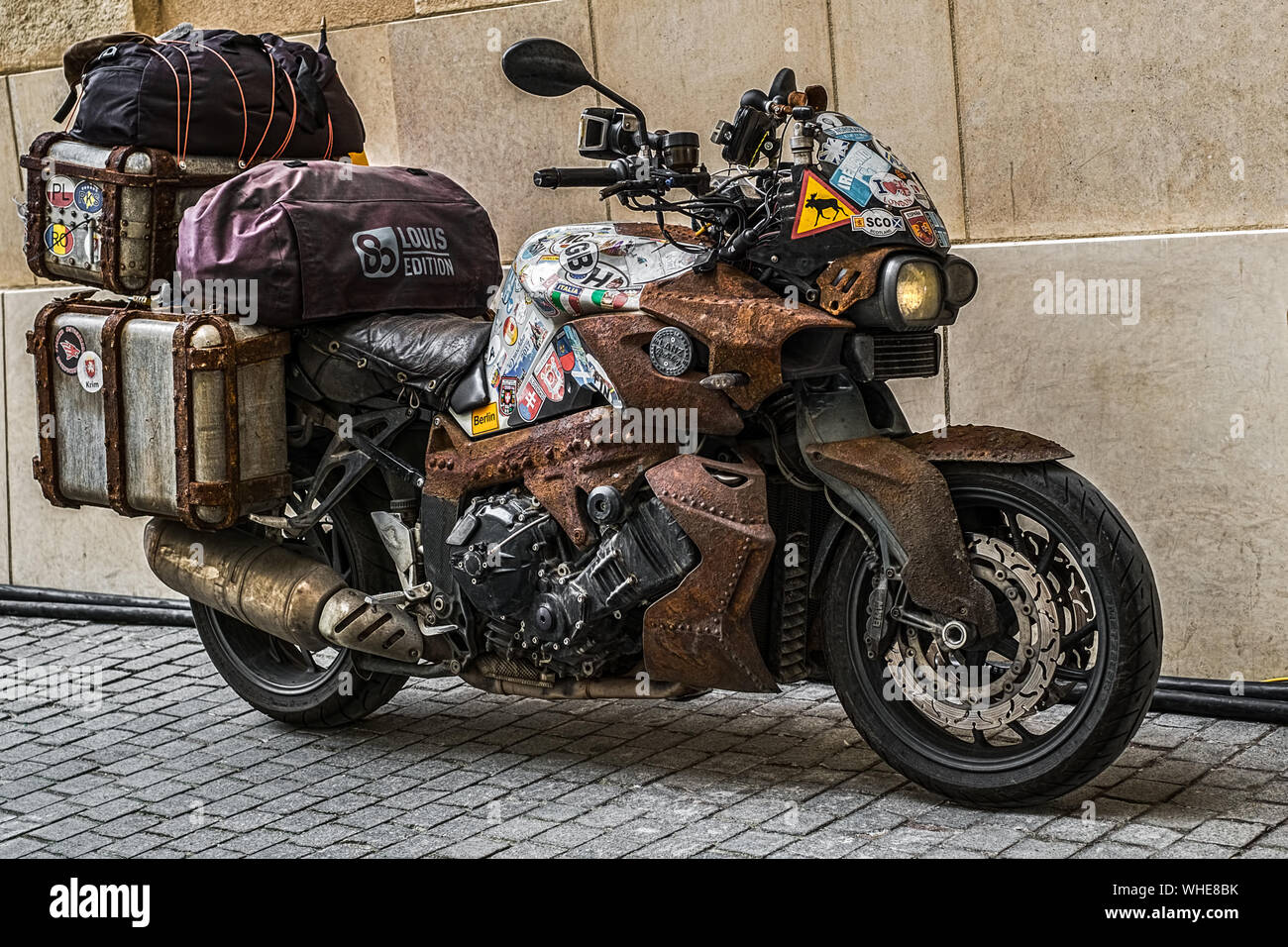 custom modern motorcycle bmw with parts that mimics rust parked in ...