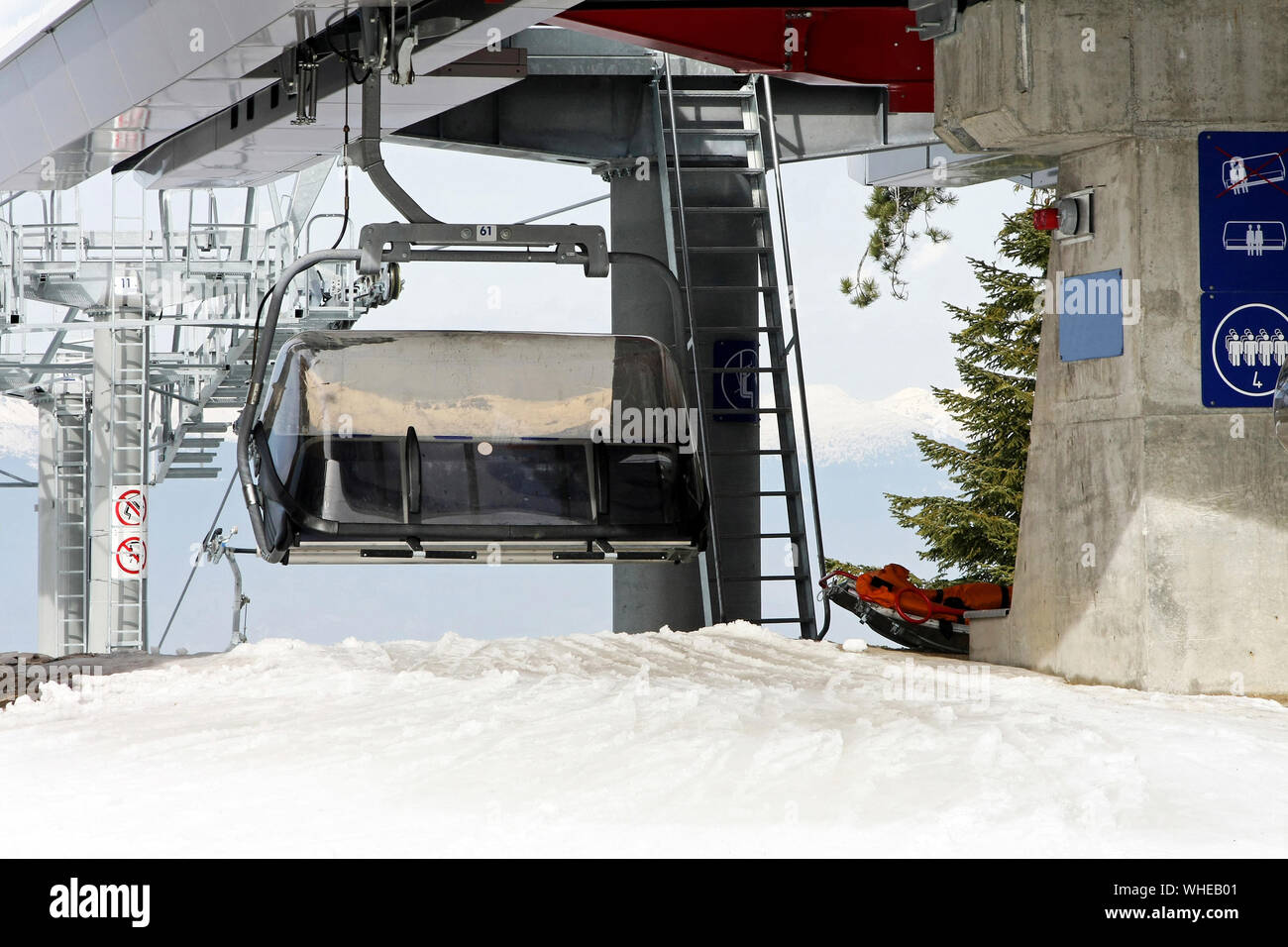 Close up shot of four-seat chair lift Stock Photo - Alamy