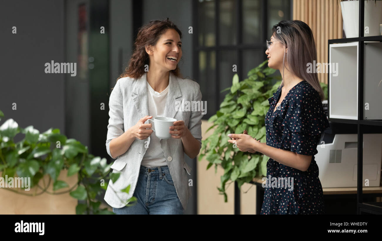 Female executive talking colleague during hi-res stock photography and ...