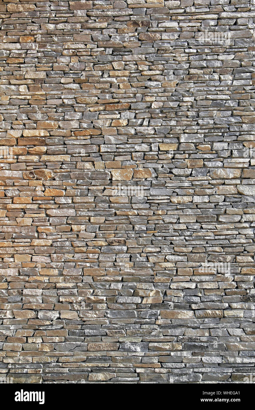 Big wall made from grey stone bricks Stock Photo - Alamy