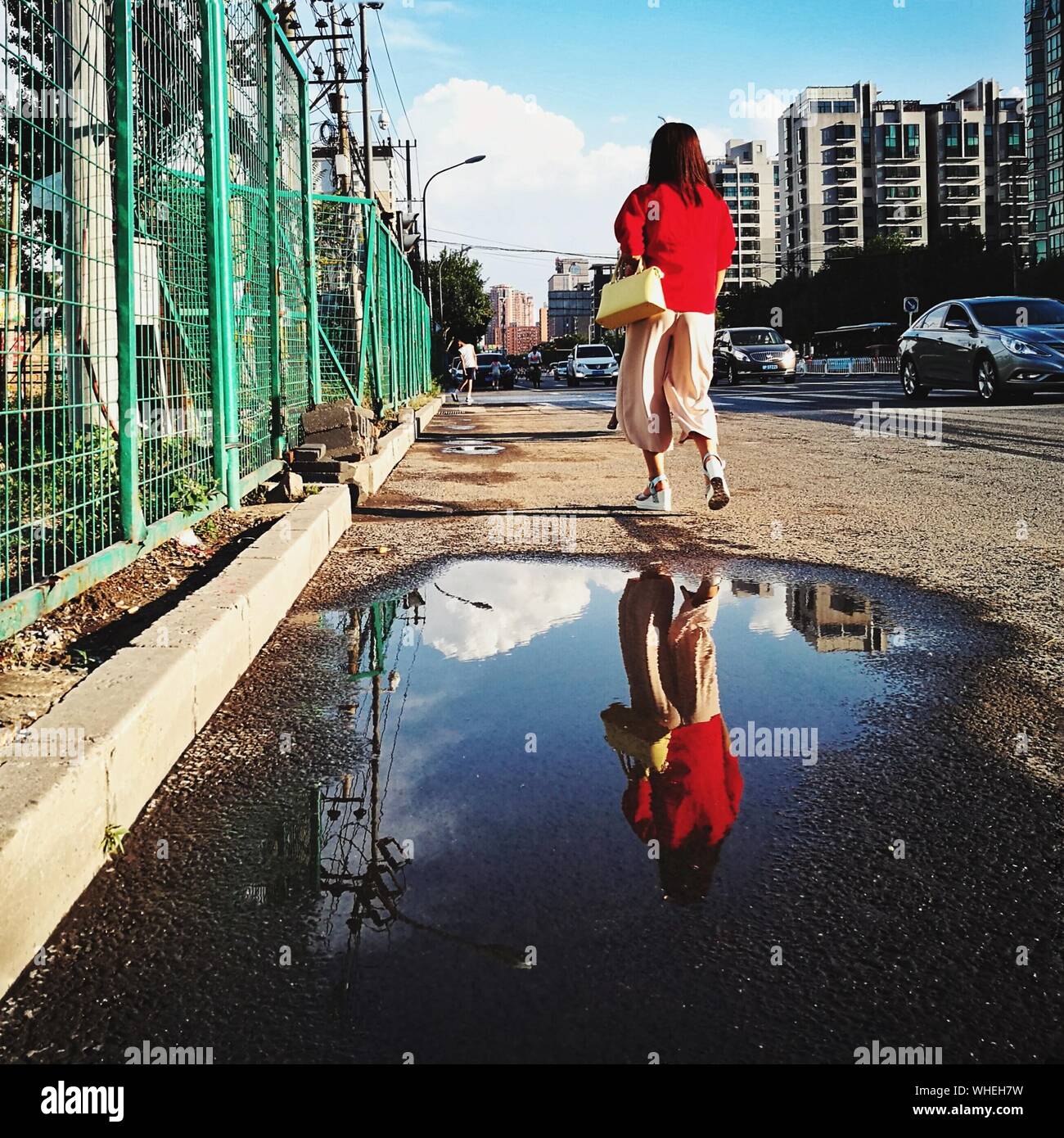 Reflection woman puddle city hi-res stock photography and images - Alamy