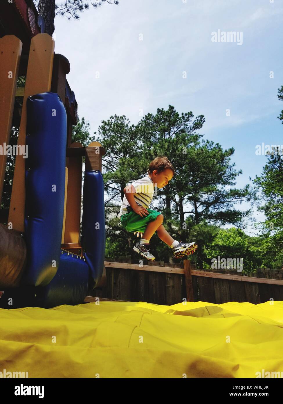 Children jumping in air in park hi-res stock photography and images - Alamy