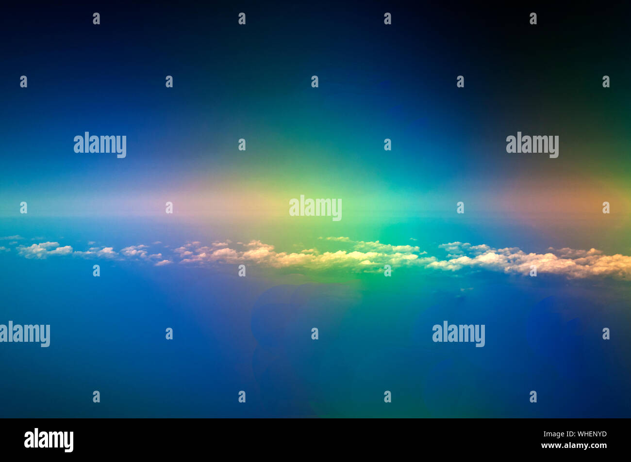 Aerial view of a string of white clouds in a multi-colour sky Stock ...