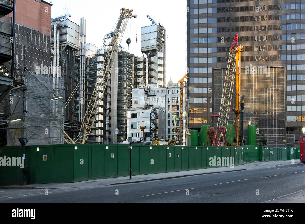 New construction site progress between big buildings Stock Photo - Alamy
