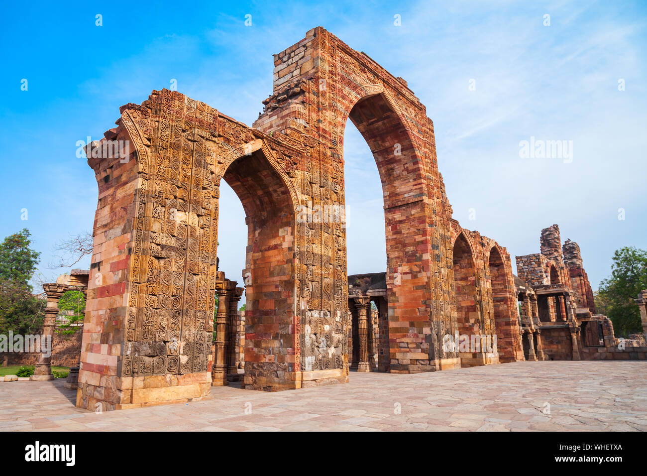 Iron pillar of Delhi or Ashoka Pillar and courtyard of Quwwat-ul-Islam ...
