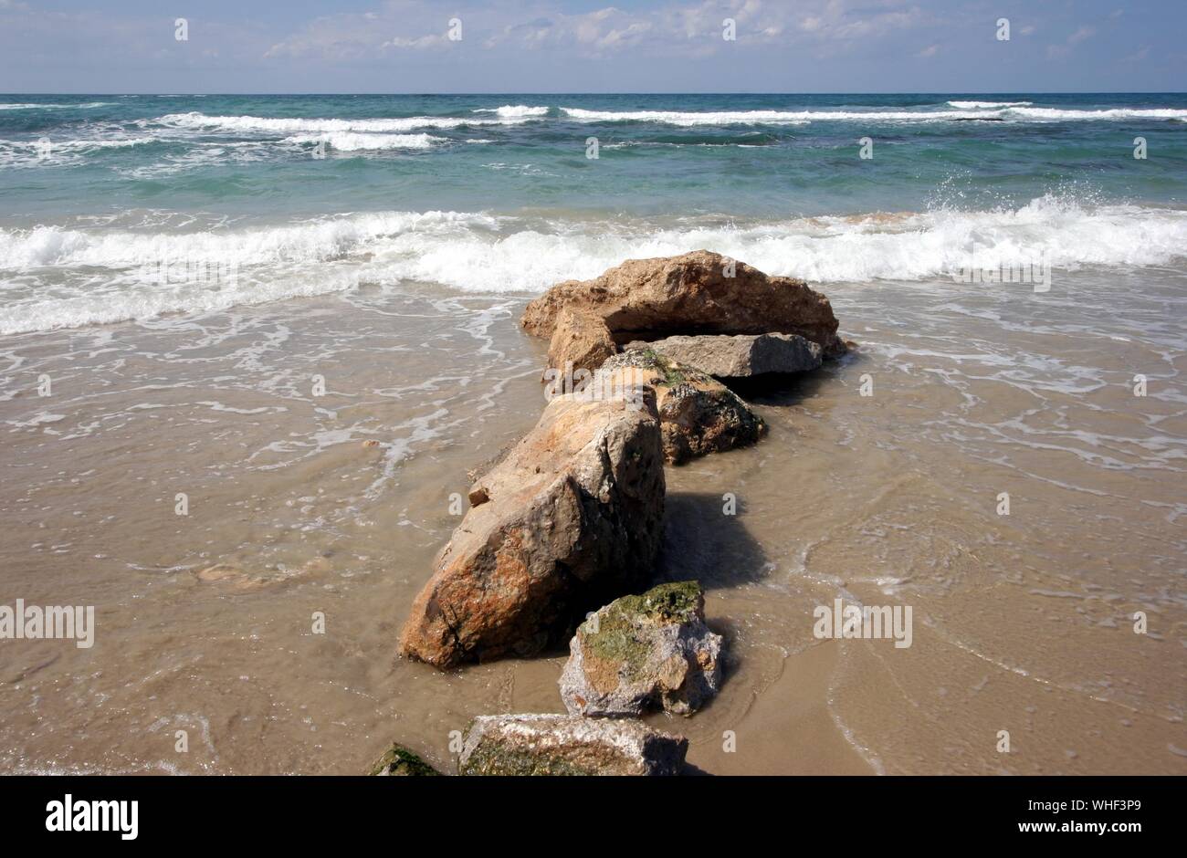 Rocks On Shore At Beach Stock Photo - Alamy