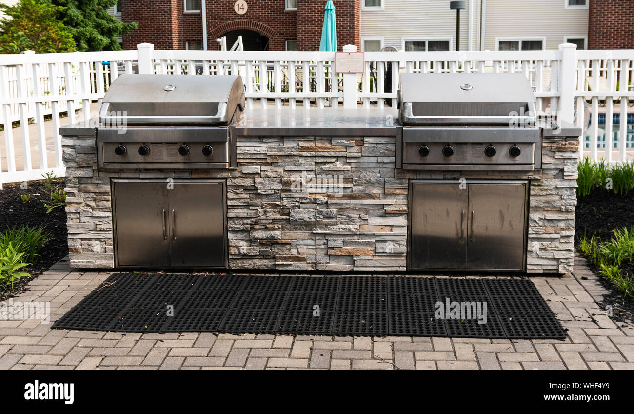 A hotel has two gas barbecue grills ready for use by patrons on ...