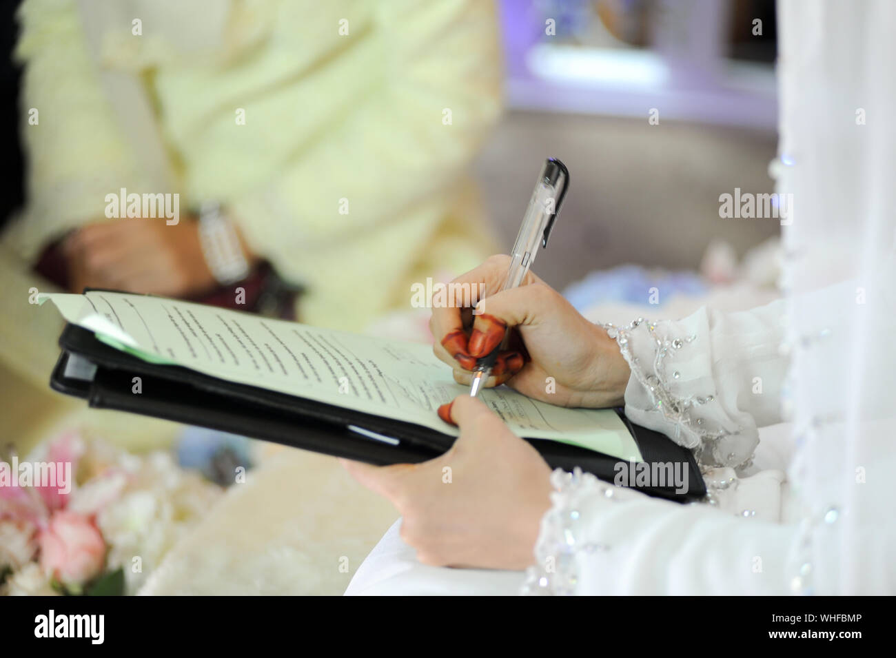 Marriage certificate signing bride hi-res stock photography and images ...