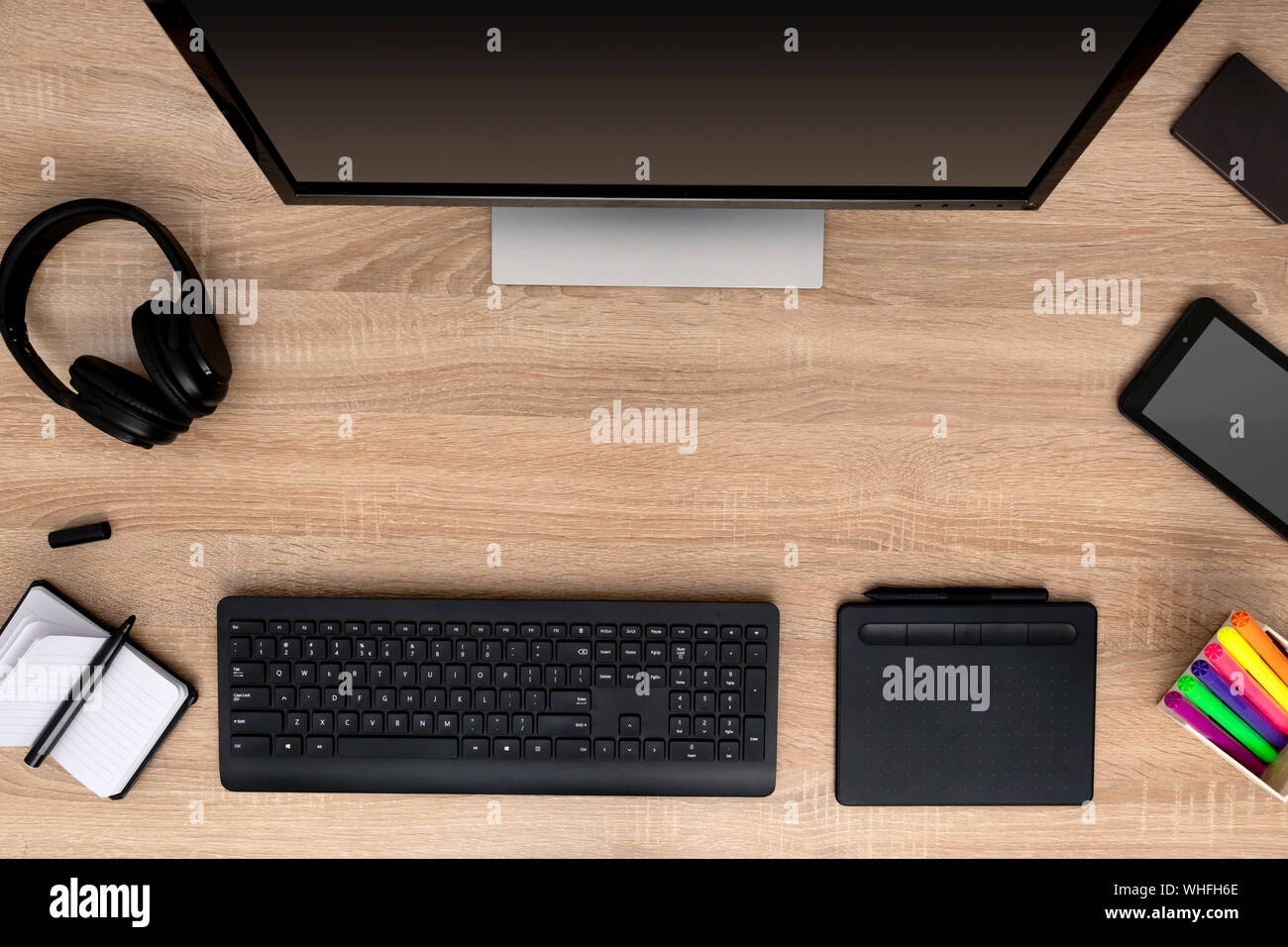 Keyboard with graphic tablet, display and headphones Stock Photo - Alamy