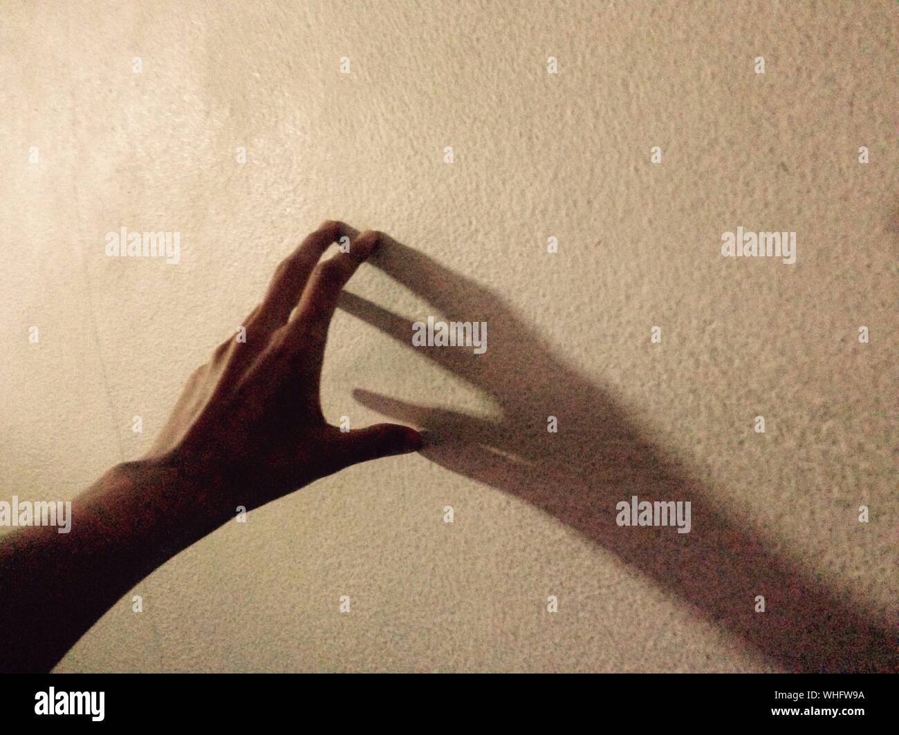 Person touching wall hi-res stock photography and images - Alamy