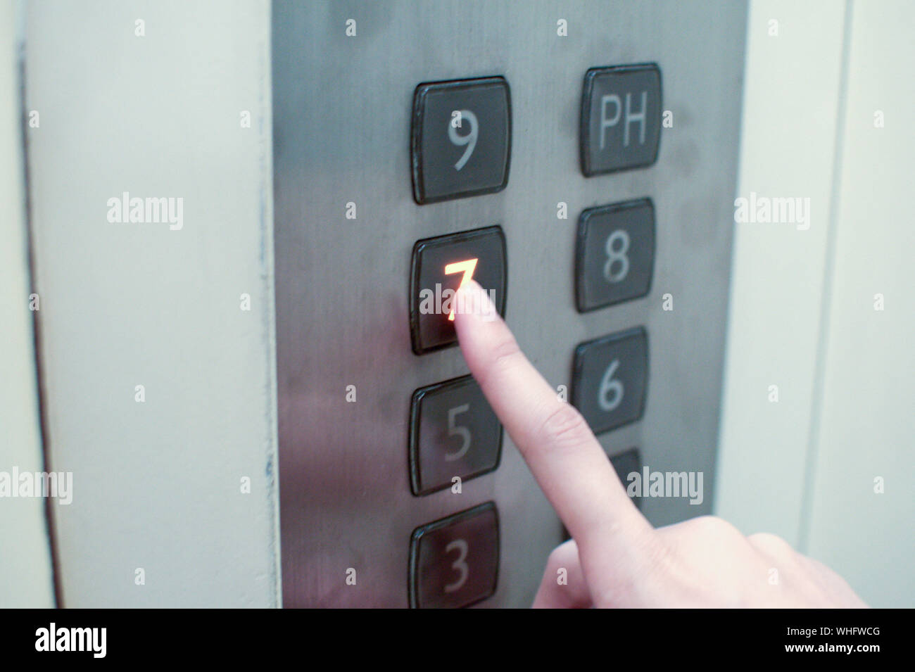 Pressing elevator button hi-res stock photography and images - Alamy