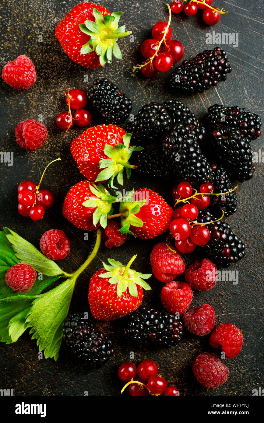 Background of fresh fruits and berries. Ripe blackberries Stock Photo ...
