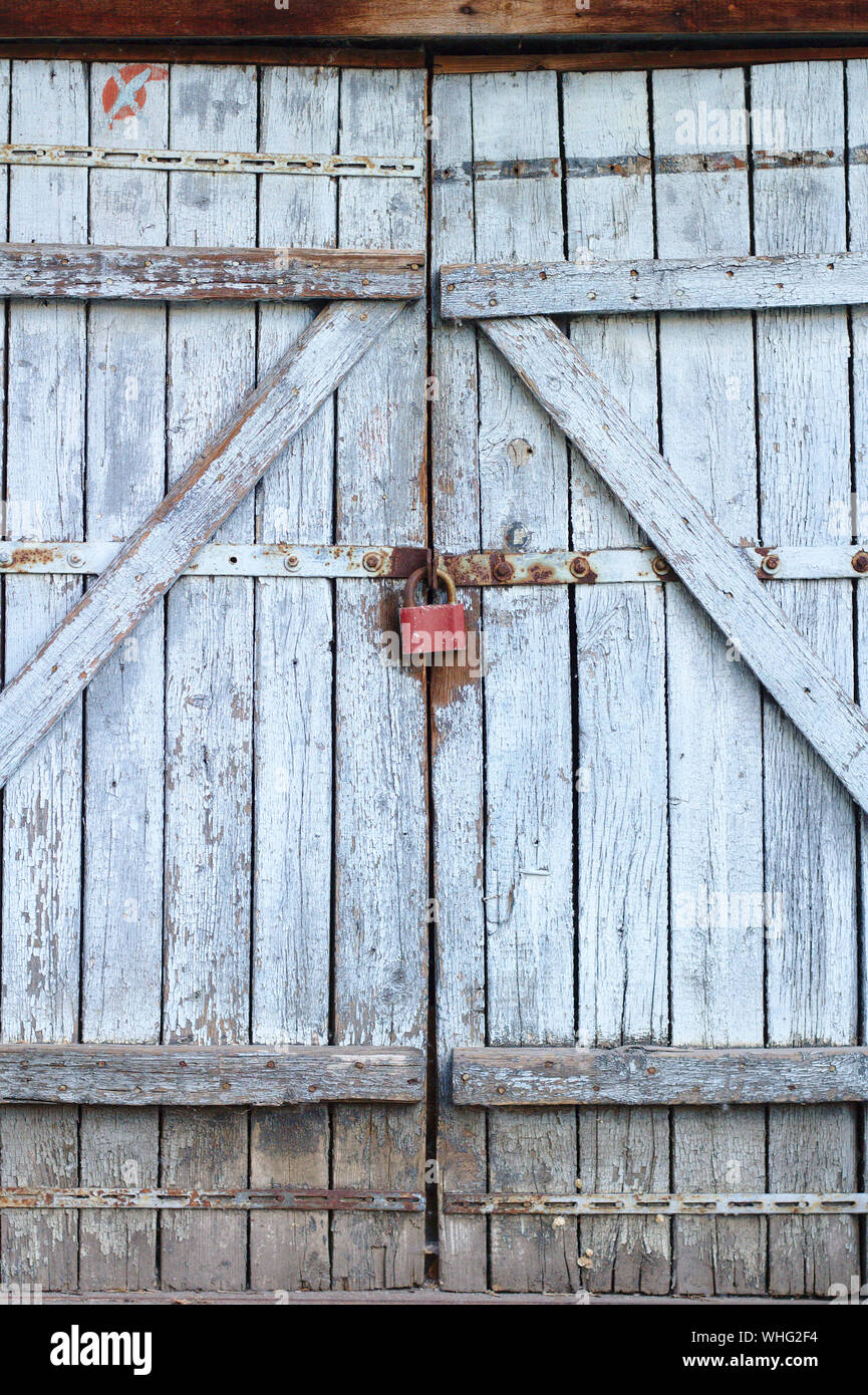 Old gray wooden plank gate with a padlock Stock Photo - Alamy
