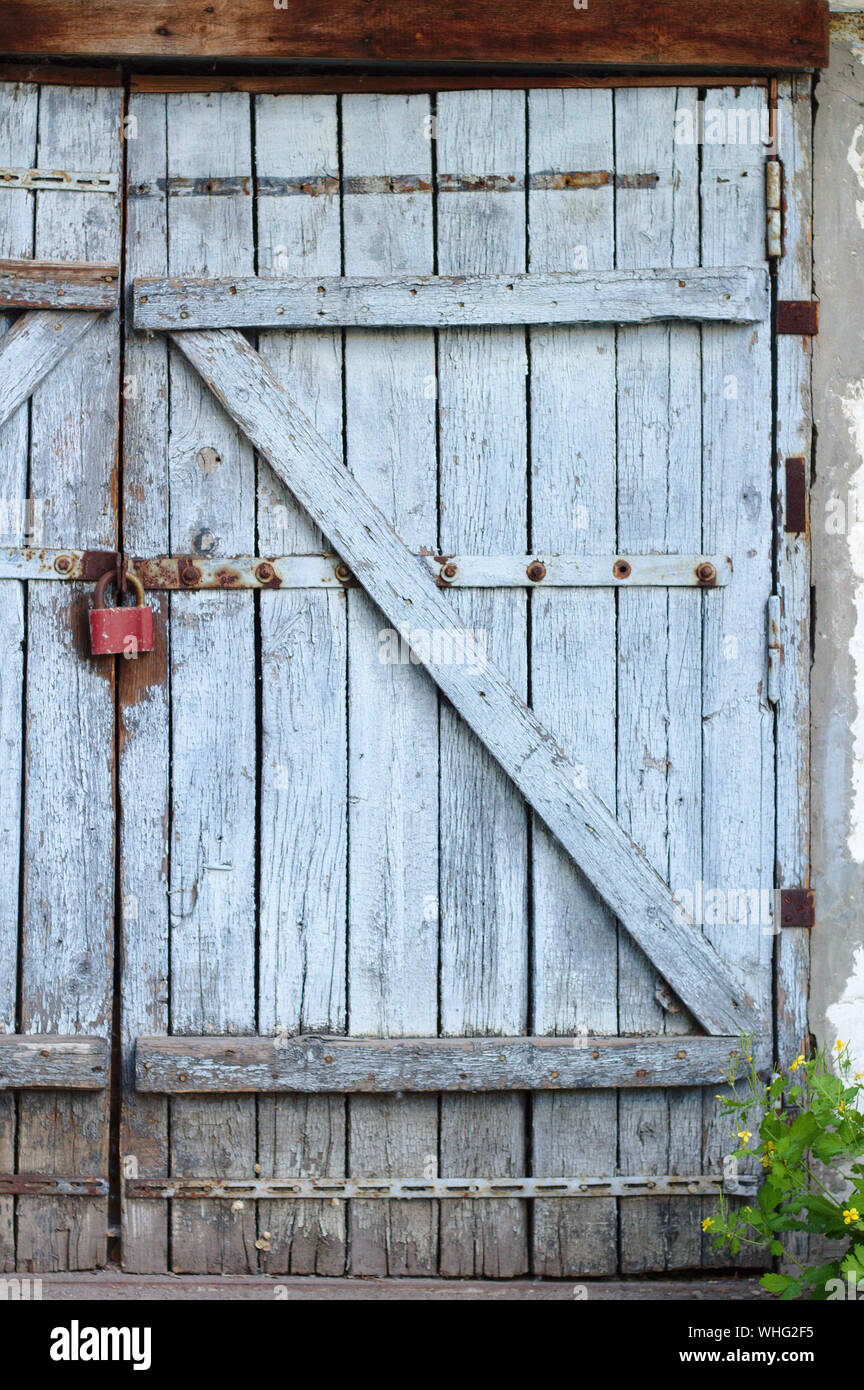 Old gray wooden plank gate with a padlock Stock Photo - Alamy