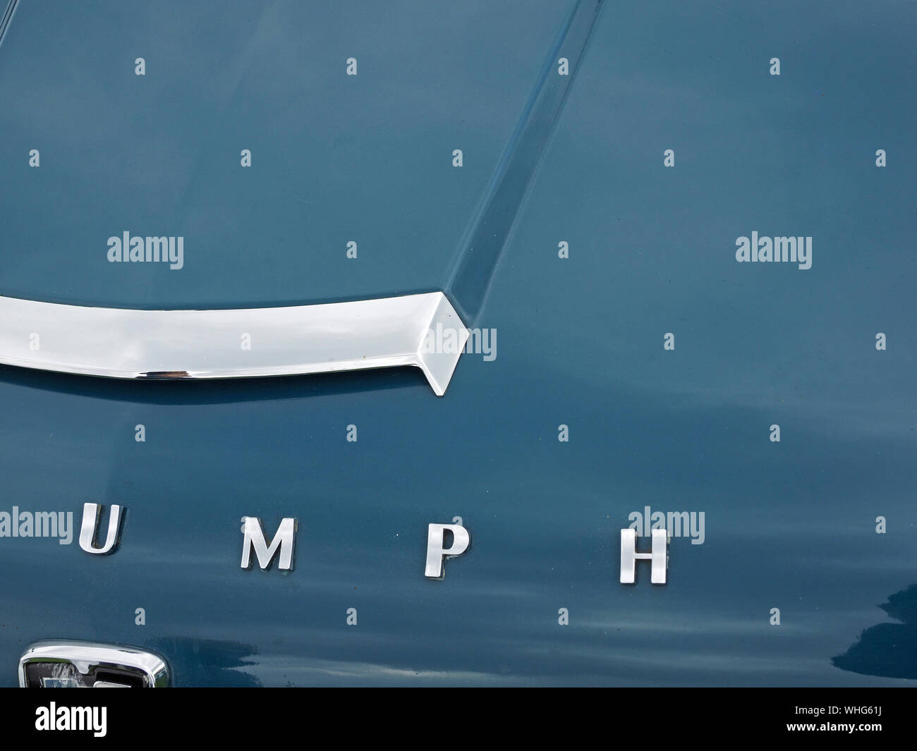 detail of bonnet (reading UMPH) with chrome strip on historic blue ...