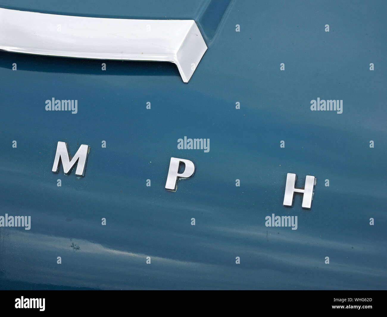 detail of bonnet (reading UMPH) with chrome strip on historic blue ...