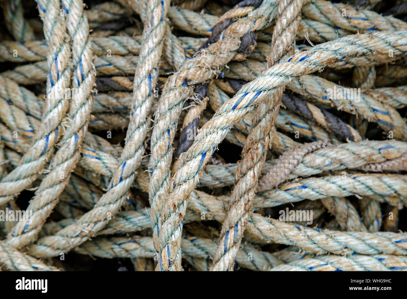 Faded blue nylon rope shot close up in landscape format for use as a ...