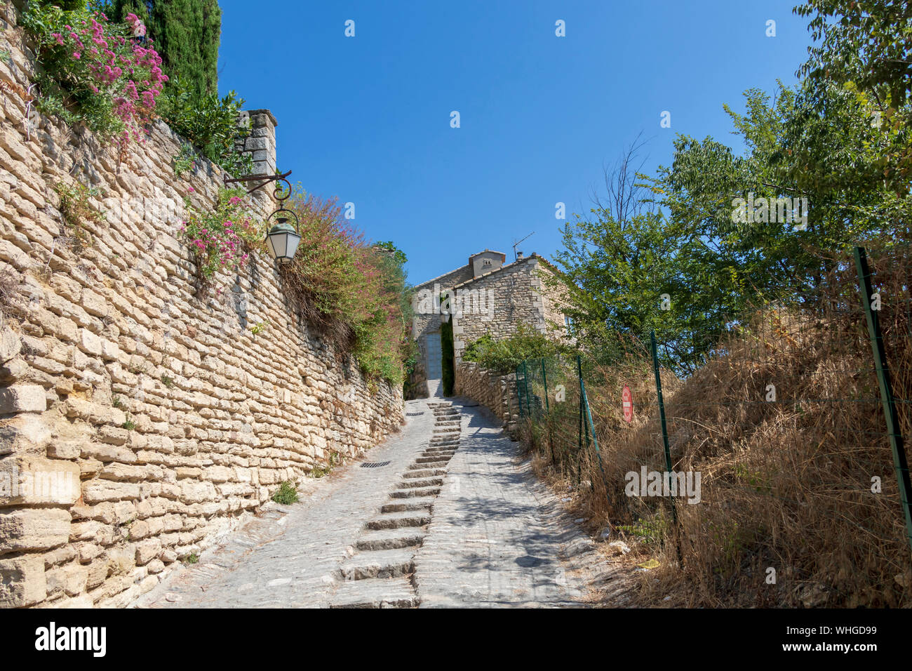 Gordes beautiful old village with pastel buildings on the hill ...