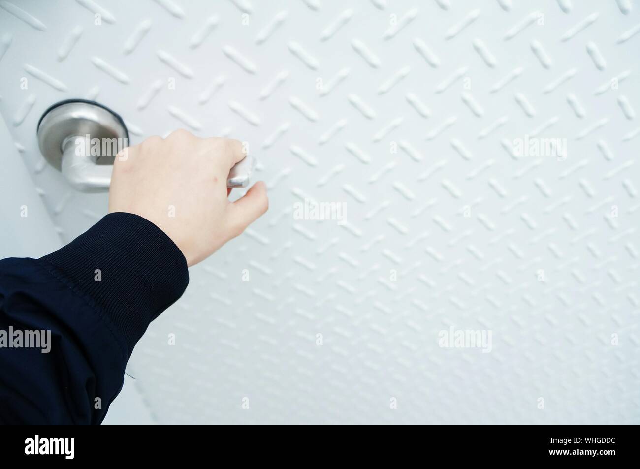 Hand on door handle hi-res stock photography and images - Alamy