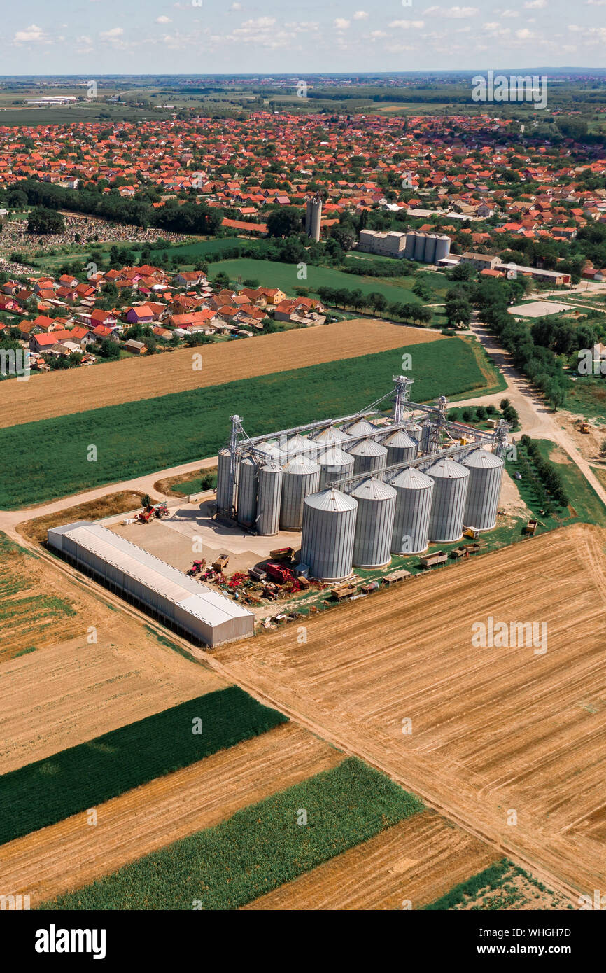 Aerial view of agricultural silo from drone pov. Modern farm building ...