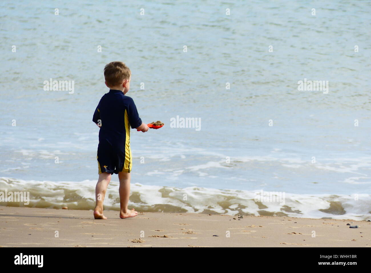 Boy playing sand pail shovel hi-res stock photography and images - Alamy