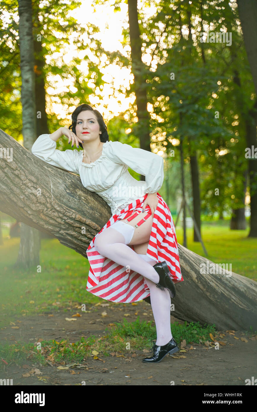 cute fashion lady in summer dress posing in the summer city park Stock ...