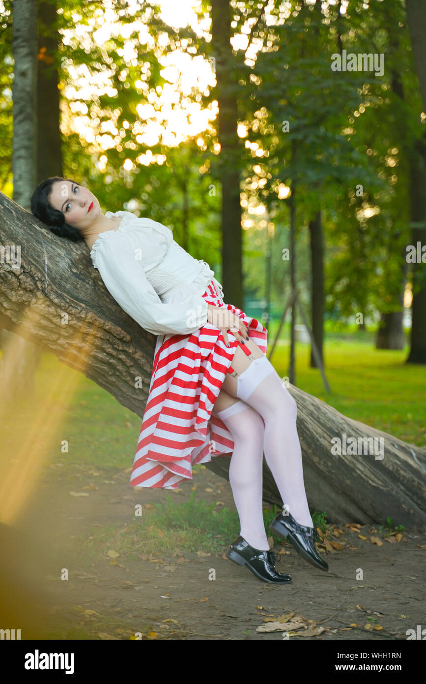 cute fashion lady in summer dress posing in the summer city park Stock ...