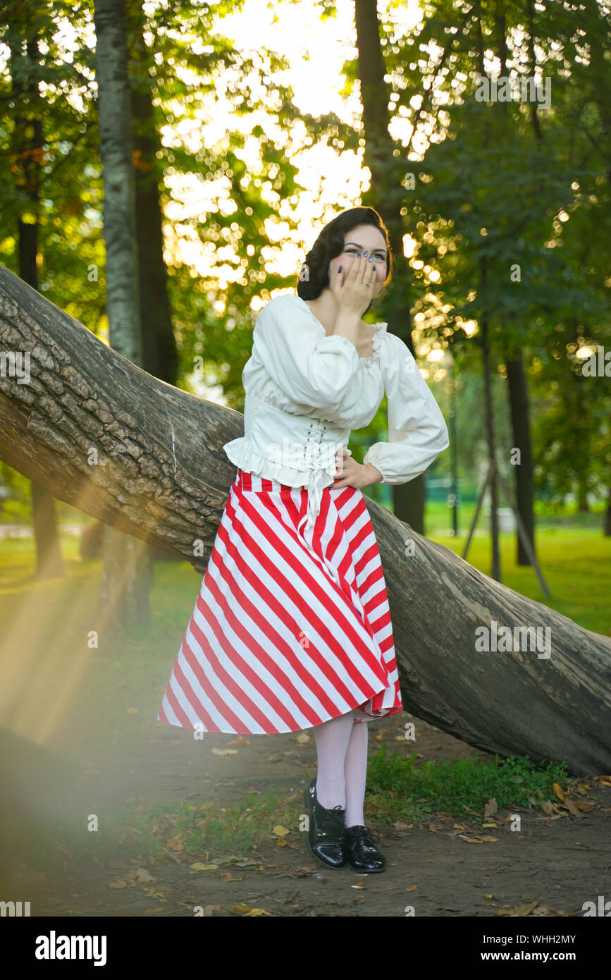 cute fashion lady in summer dress posing in the summer city park Stock ...
