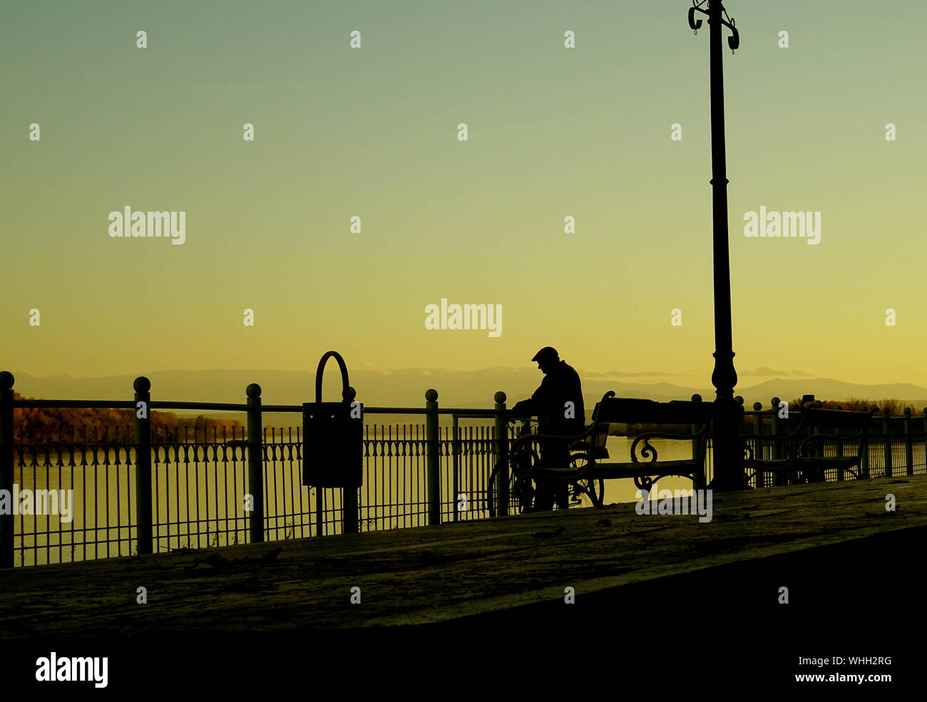 Man on railing hi-res stock photography and images - Alamy