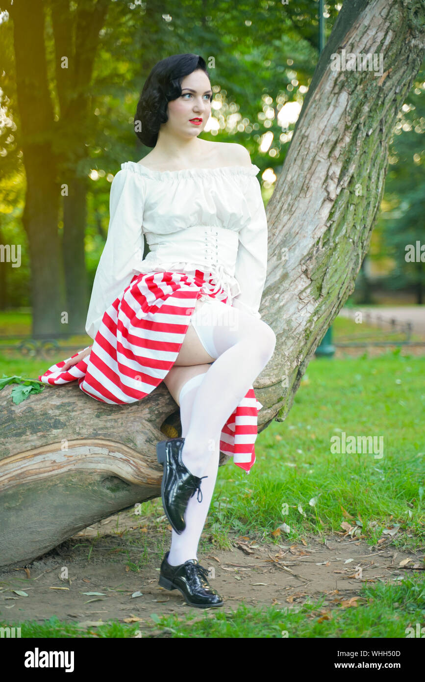 cute fashion lady in summer dress posing in the summer city park Stock ...