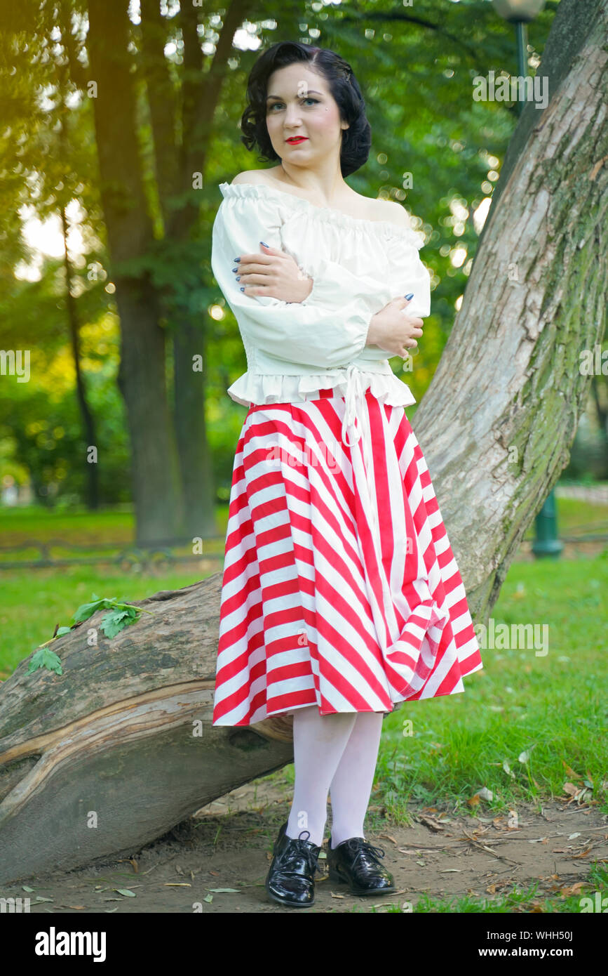 cute fashion lady in summer dress posing in the summer city park Stock ...