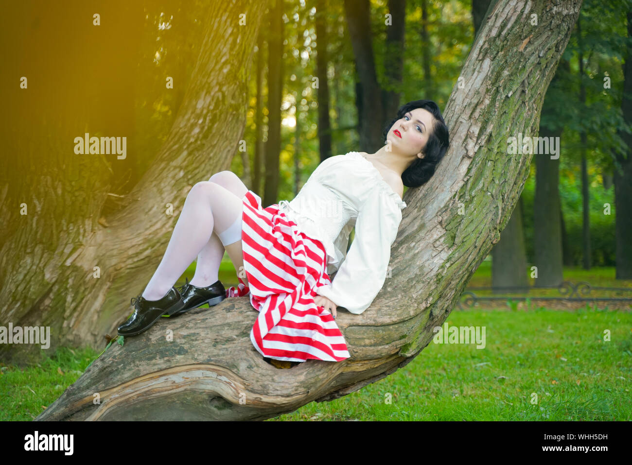 cute fashion lady in summer dress posing in the summer city park Stock ...