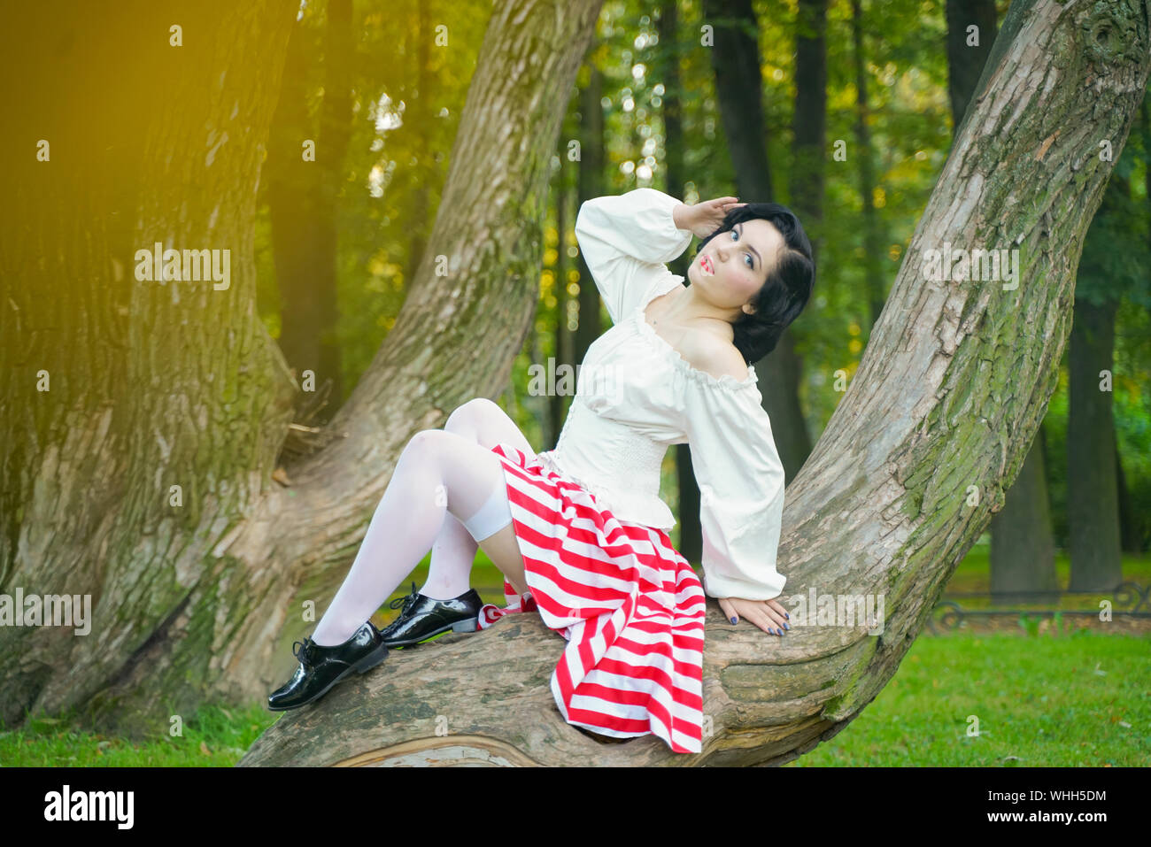 cute fashion lady in summer dress posing in the summer city park Stock ...