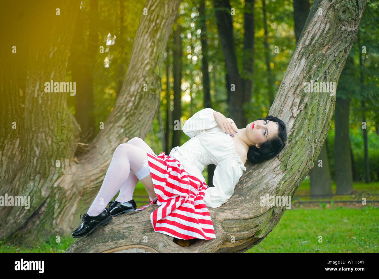 cute fashion lady in summer dress posing in the summer city park Stock ...