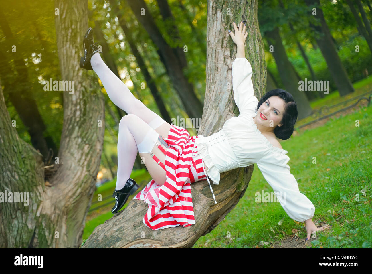 cute fashion lady in summer dress posing in the summer city park Stock ...