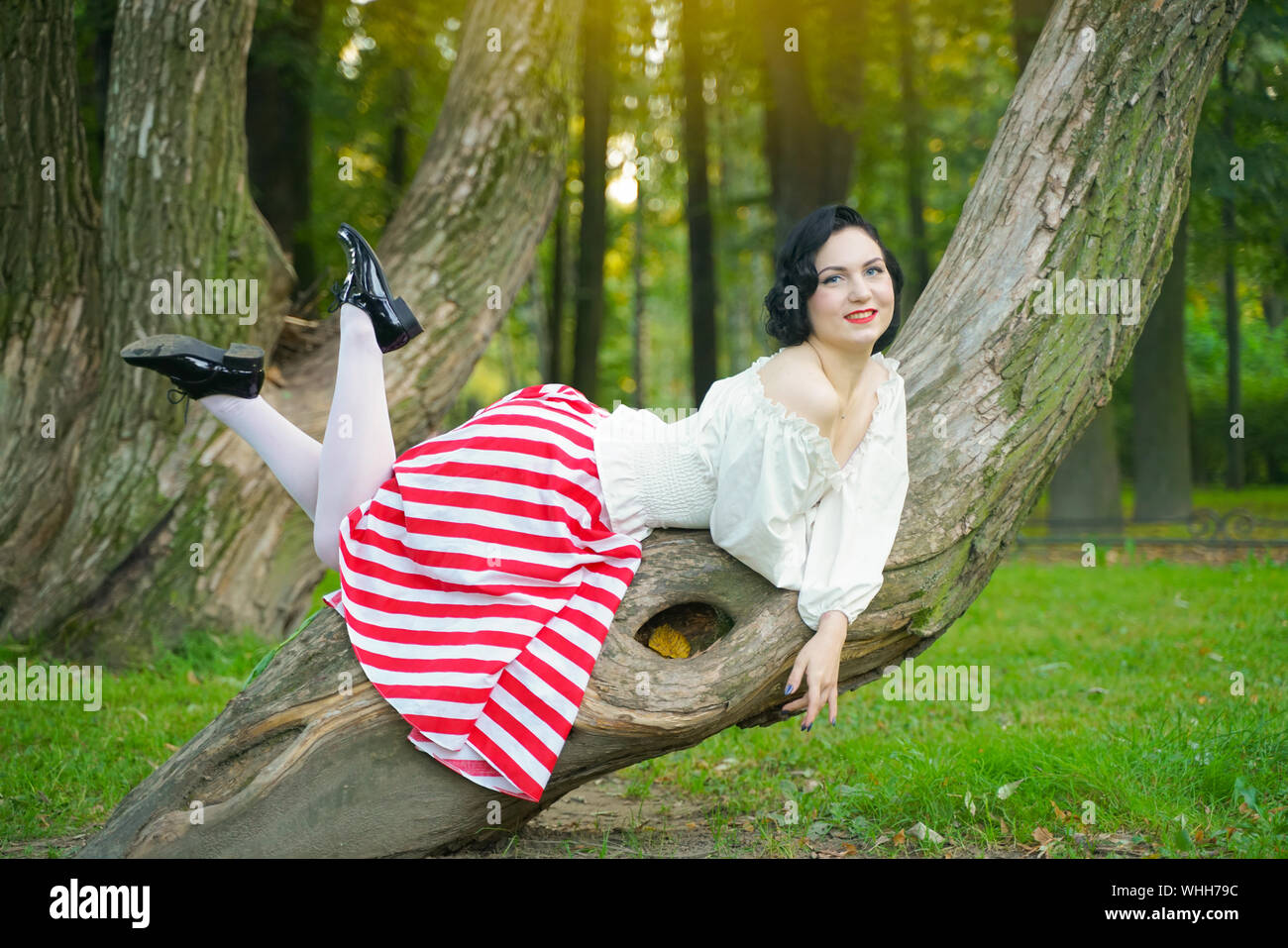 cute fashion lady in summer dress posing in the summer city park Stock ...