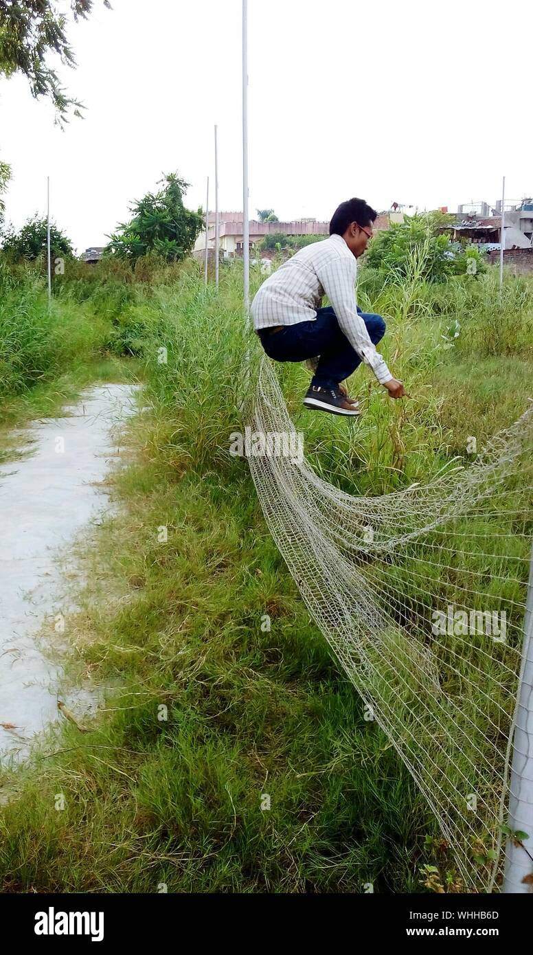 Man jumping over fence hi-res stock photography and images - Alamy